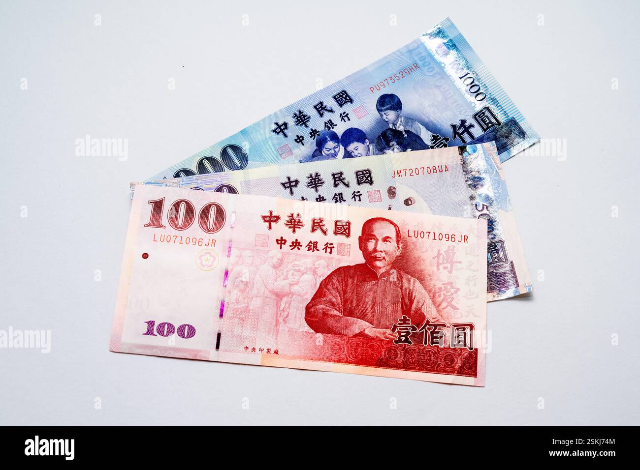 A Large Spread of New Taiwan Dollar Banknotes, Representing Wealth and ...