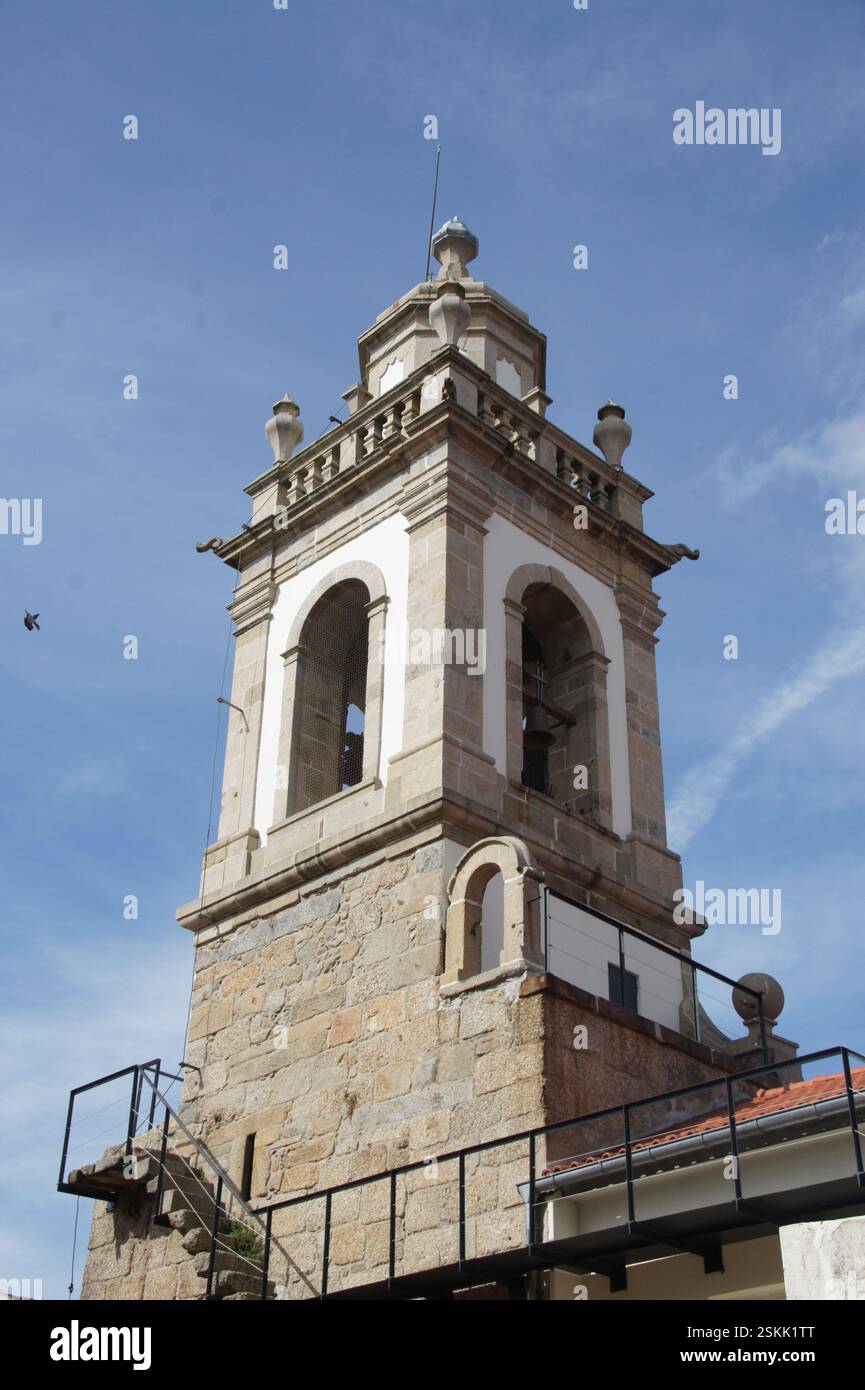 Stone bell tower with arched openings dominates the Braga skyline ...