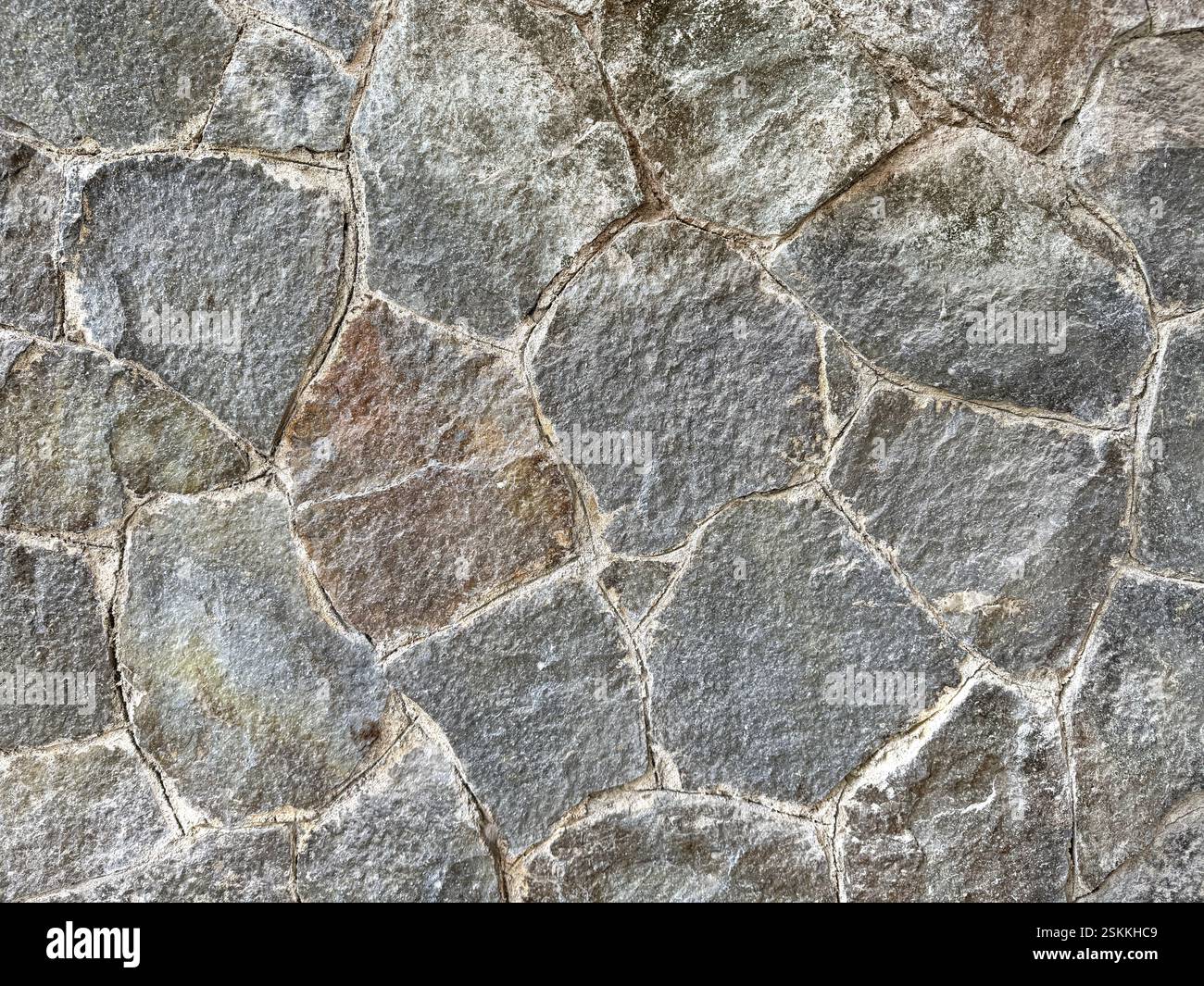 Natural random cut grey flagstone flattened on a surface. Or a series ...