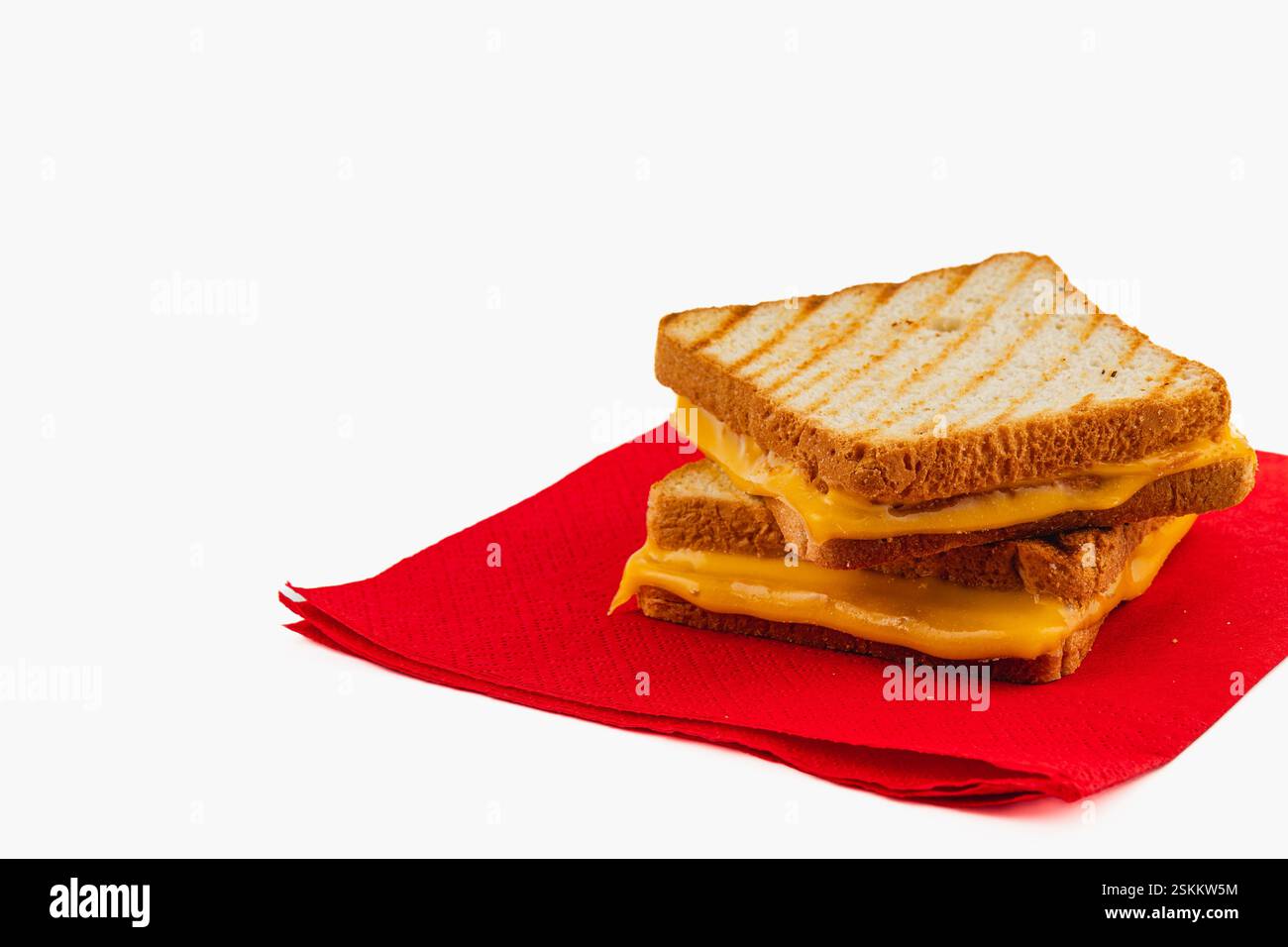 This grilled cheese sandwich showcases layers of melted cheddar cheese ...