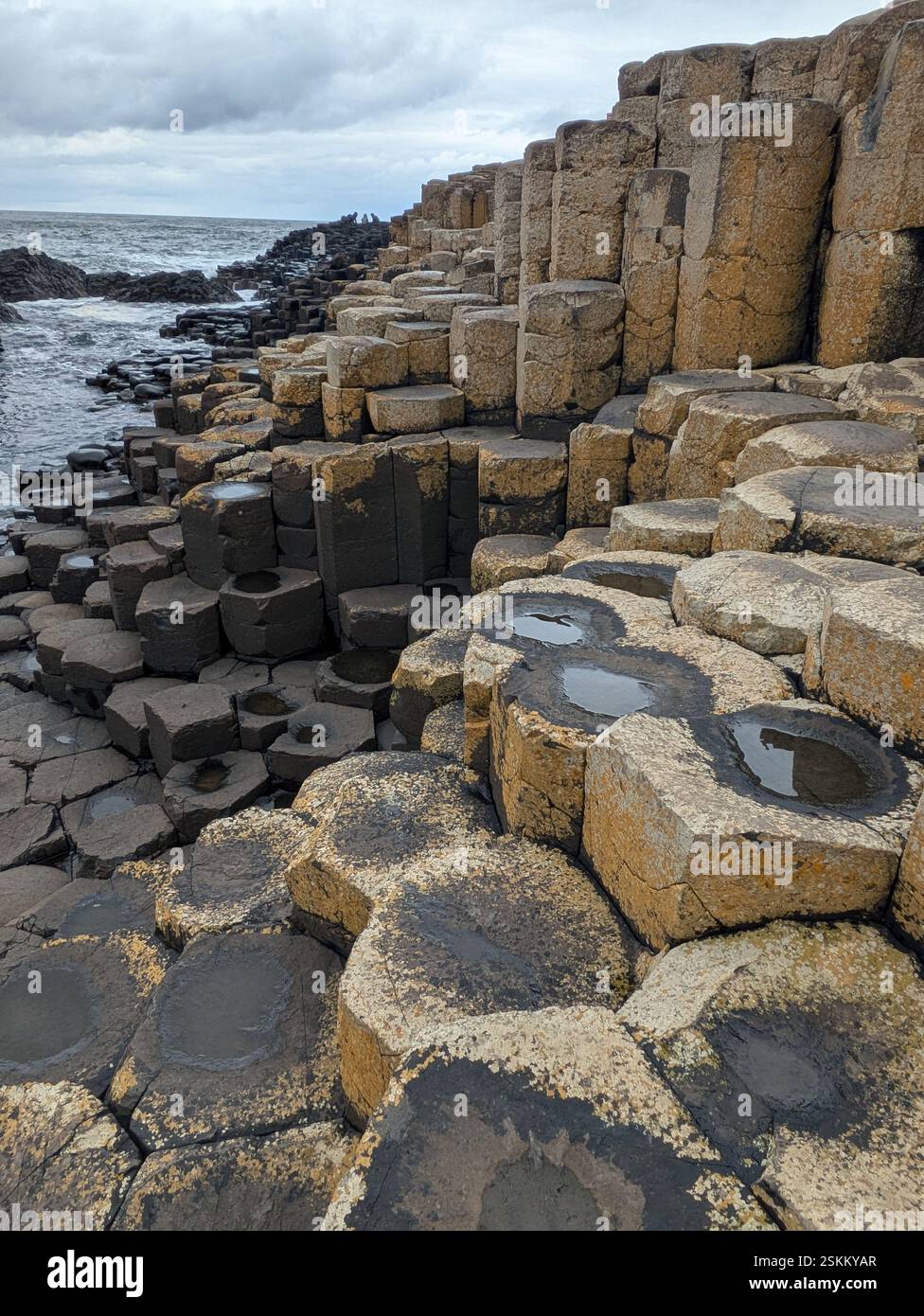 hiking along the Giants Causeway cliffs Stock Photo - Alamy