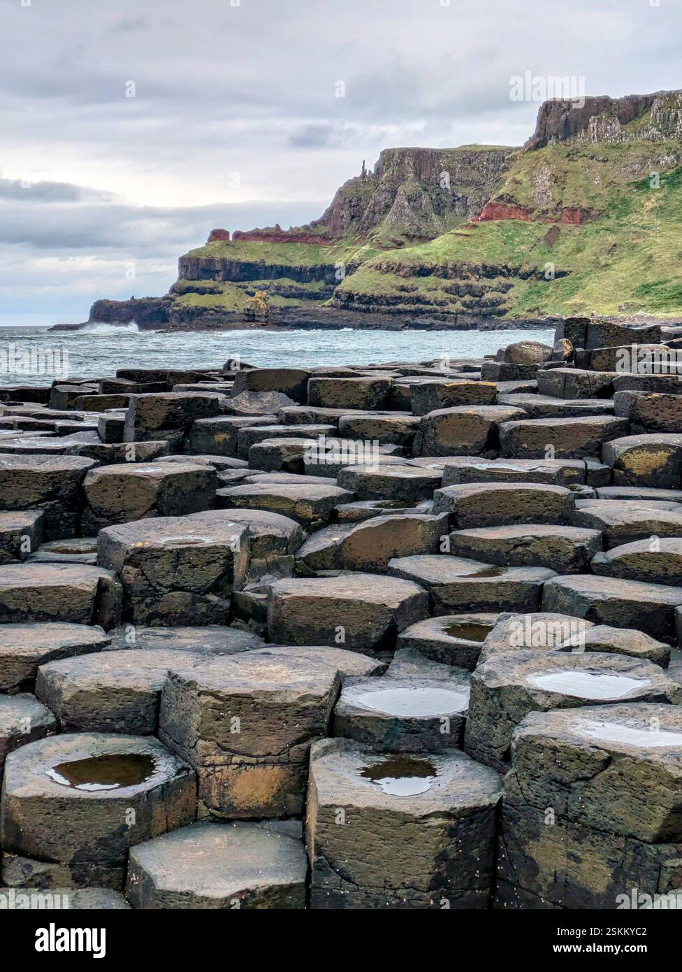 hiking along the Giants Causeway cliffs Stock Photo - Alamy