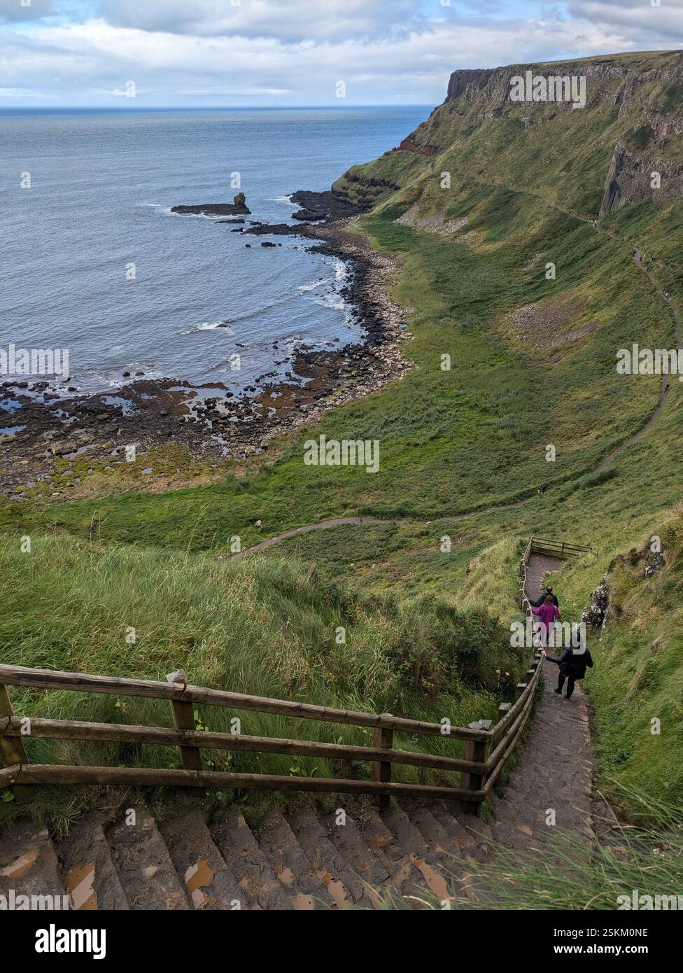 hiking along the Giants Causeway cliffs Stock Photo - Alamy