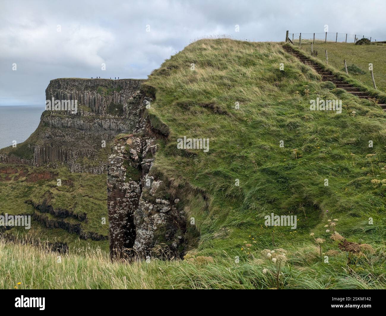 hiking along the Giants Causeway cliffs Stock Photo - Alamy