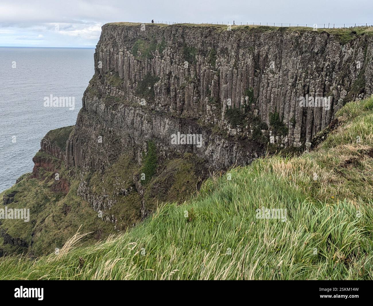 hiking along the Giants Causeway cliffs Stock Photo - Alamy