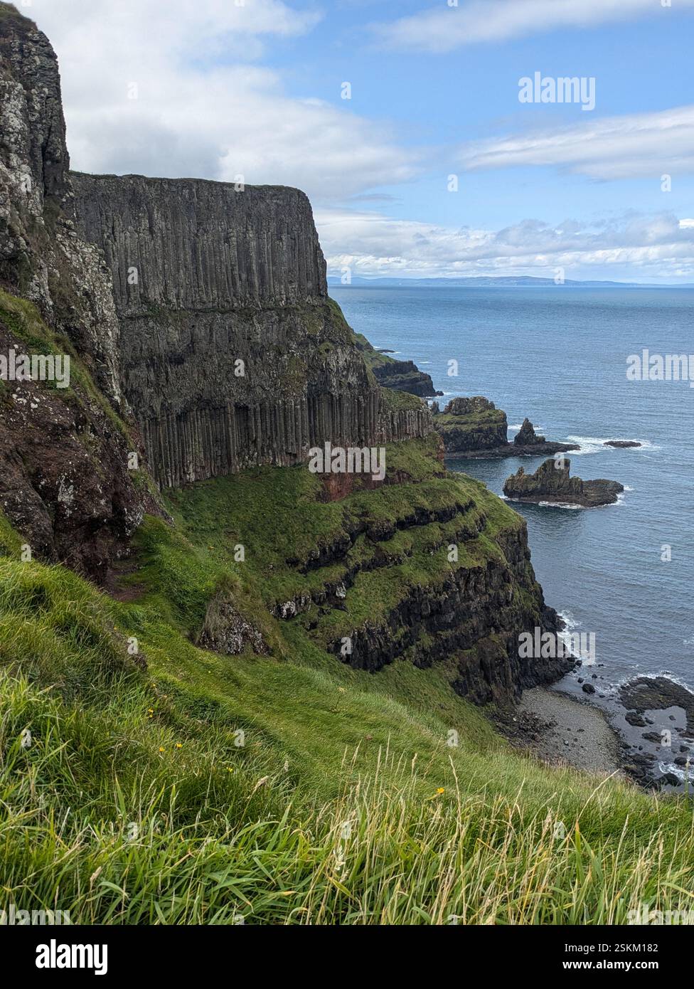 hiking along the Giants Causeway cliffs Stock Photo - Alamy