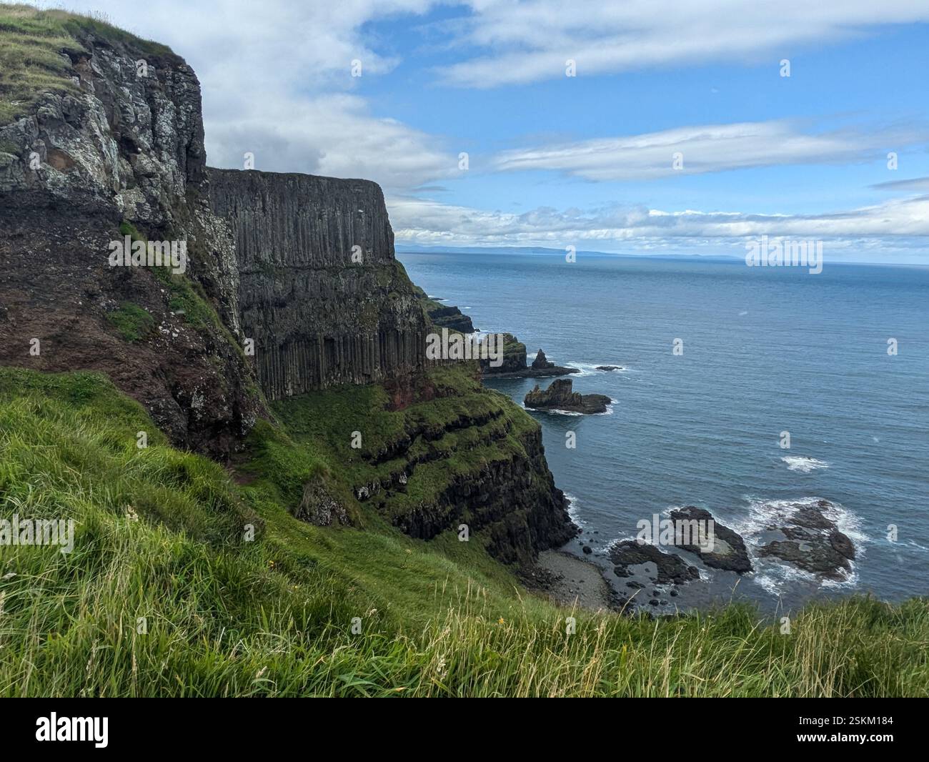 hiking along the Giants Causeway cliffs Stock Photo - Alamy