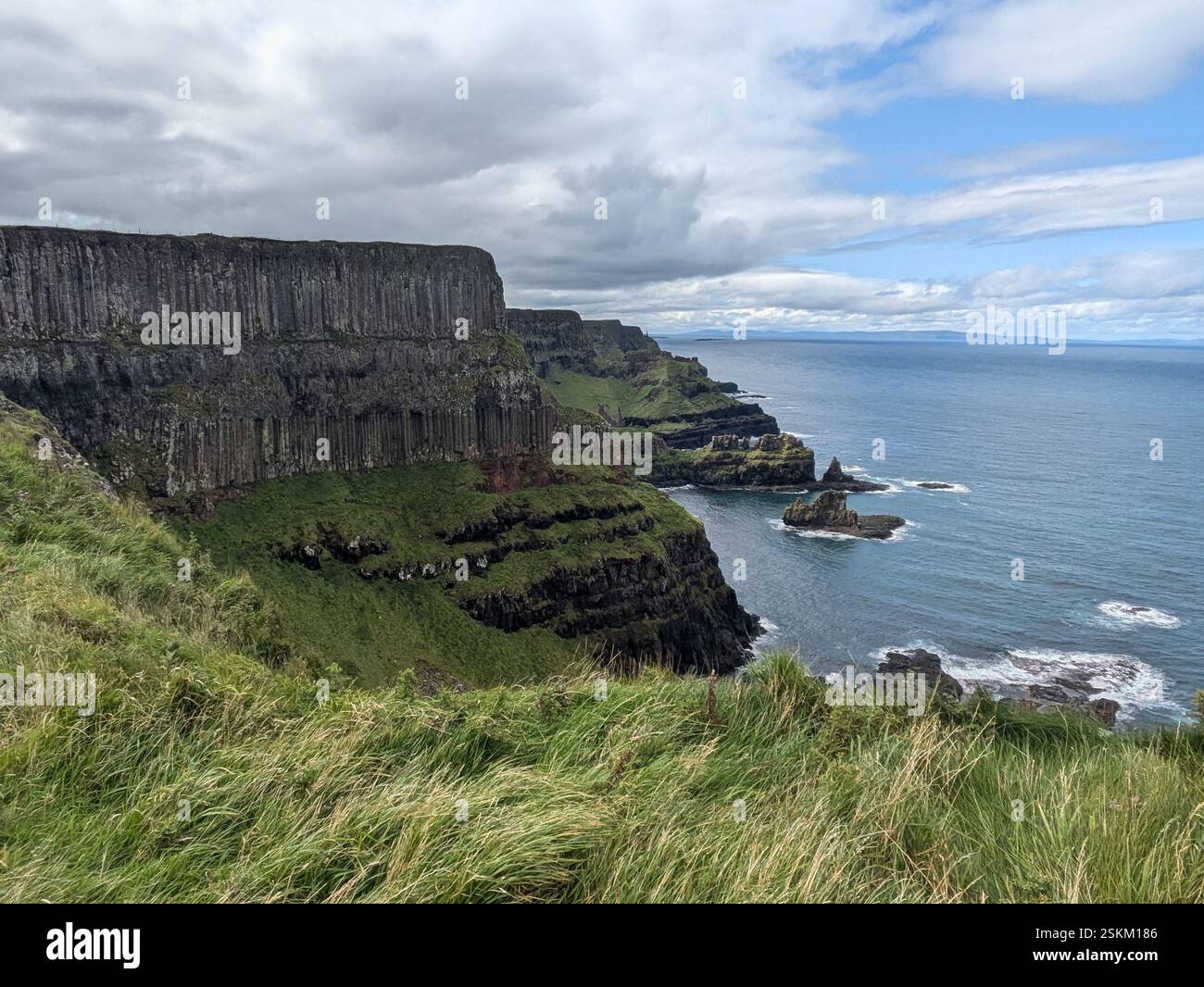 hiking along the Giants Causeway cliffs Stock Photo - Alamy