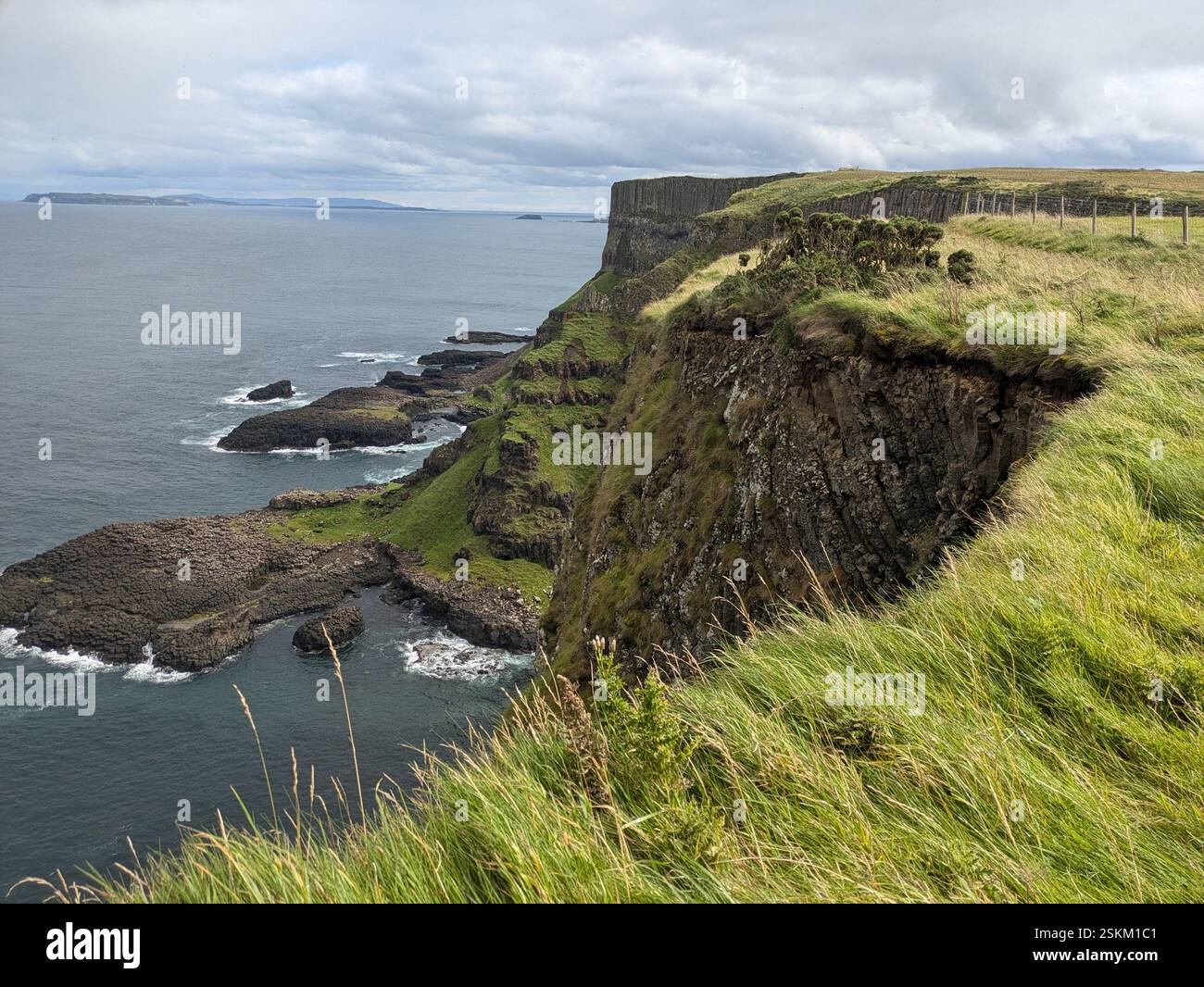 hiking along the Giants Causeway cliffs Stock Photo - Alamy