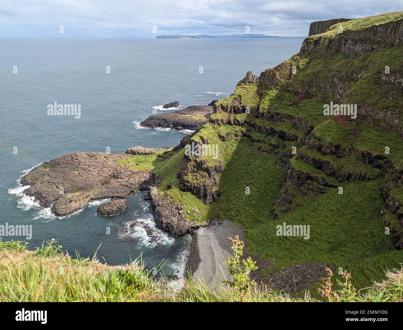 hiking along the Giants Causeway cliffs Stock Photo - Alamy