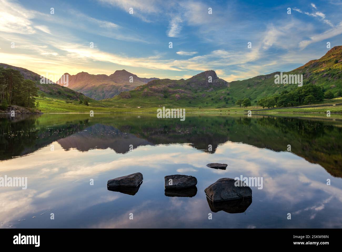 Reflections in water at Blea Tarn on a late Summer evening in The Lake ...