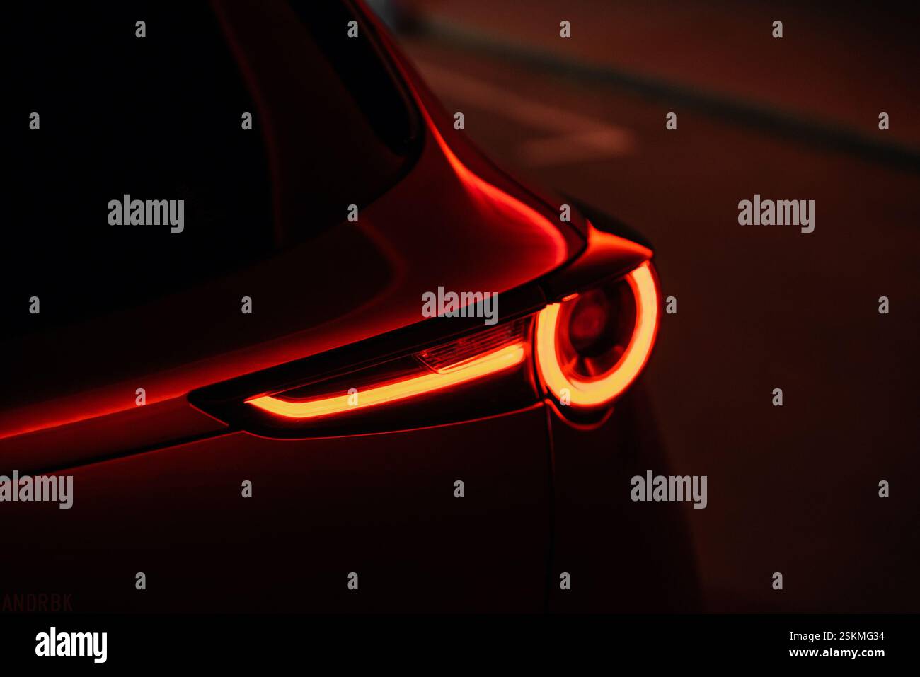 Tail light of modern red car at night. Close-up image of glowing LED ...