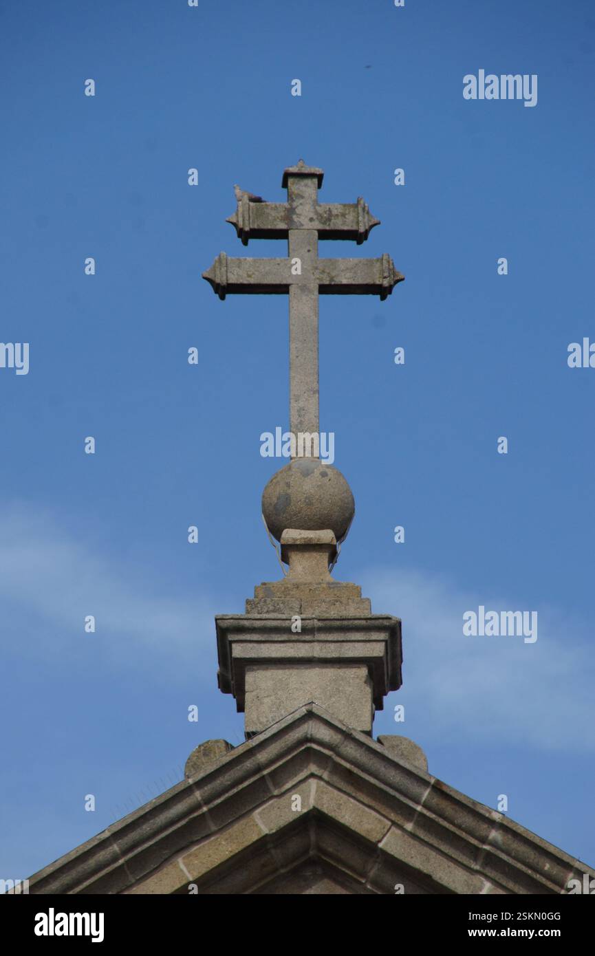 Stone cross with intricate carvings adorns a Braga, Portugal building ...