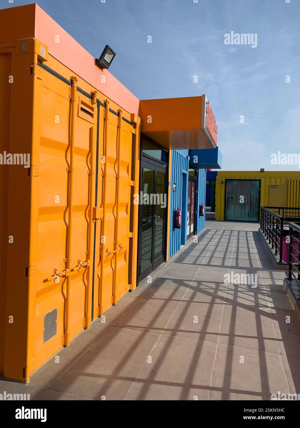 Colourful shipping containers in Doha Qatar Stock Photo - Alamy