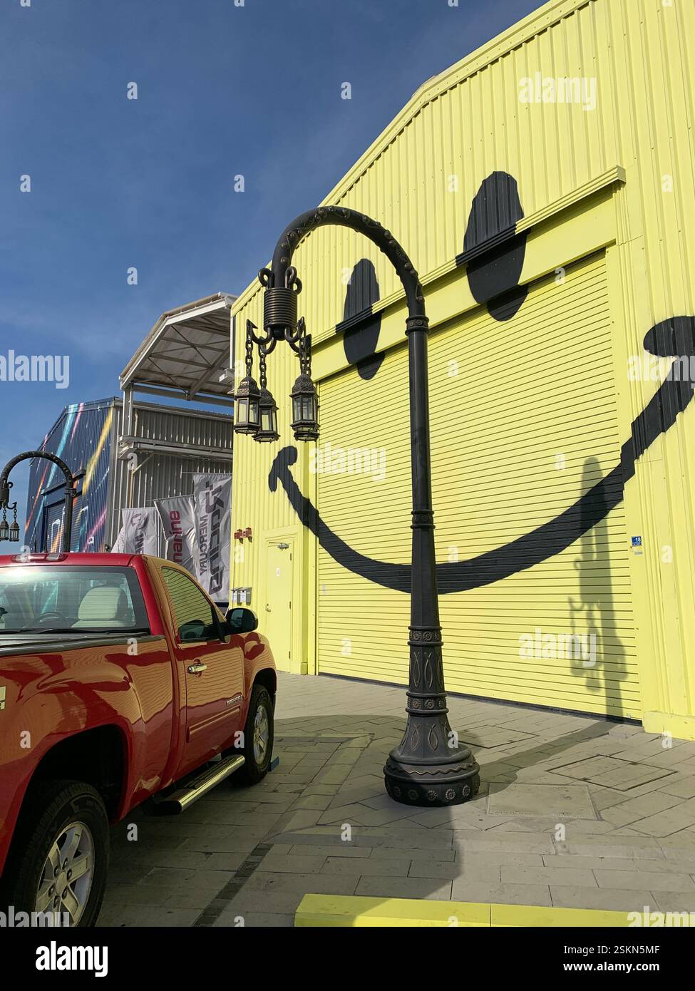 Colourful shipping containers with smiley face art at Doha Old Port ...