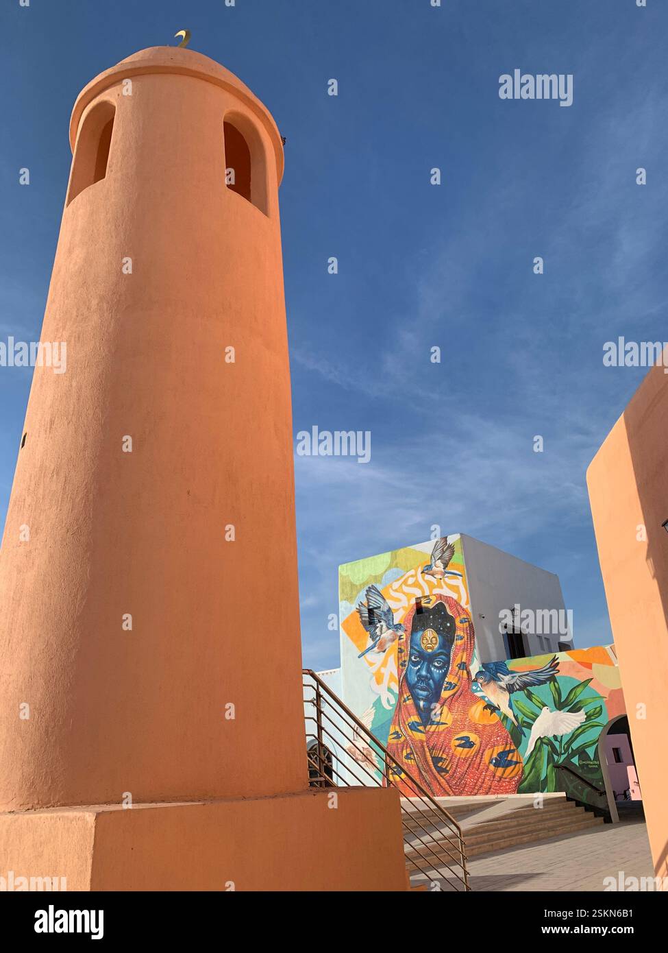 Pastel colour clay buildings at Doha Old Port Stock Photo - Alamy