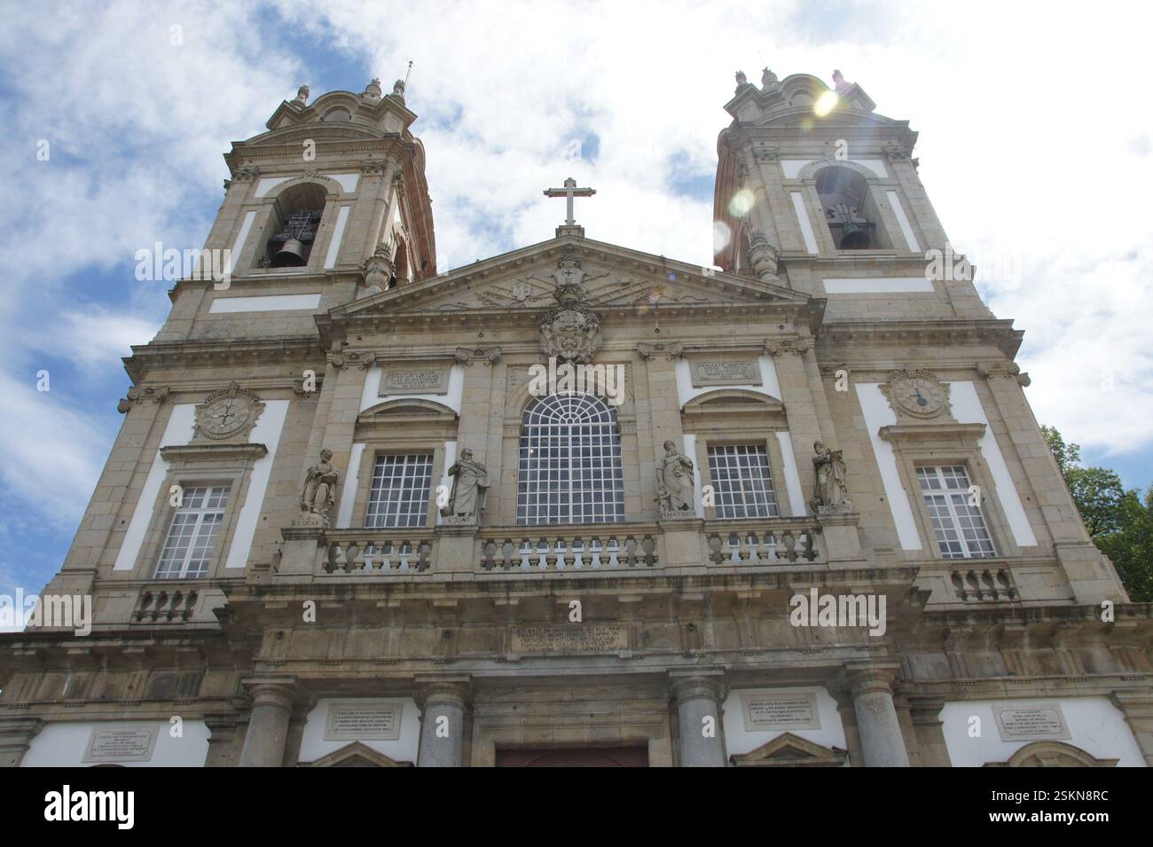 Braga, Portugal. Imposing Baroque church facade. Twin bell towers rise above ornate sculptures ...