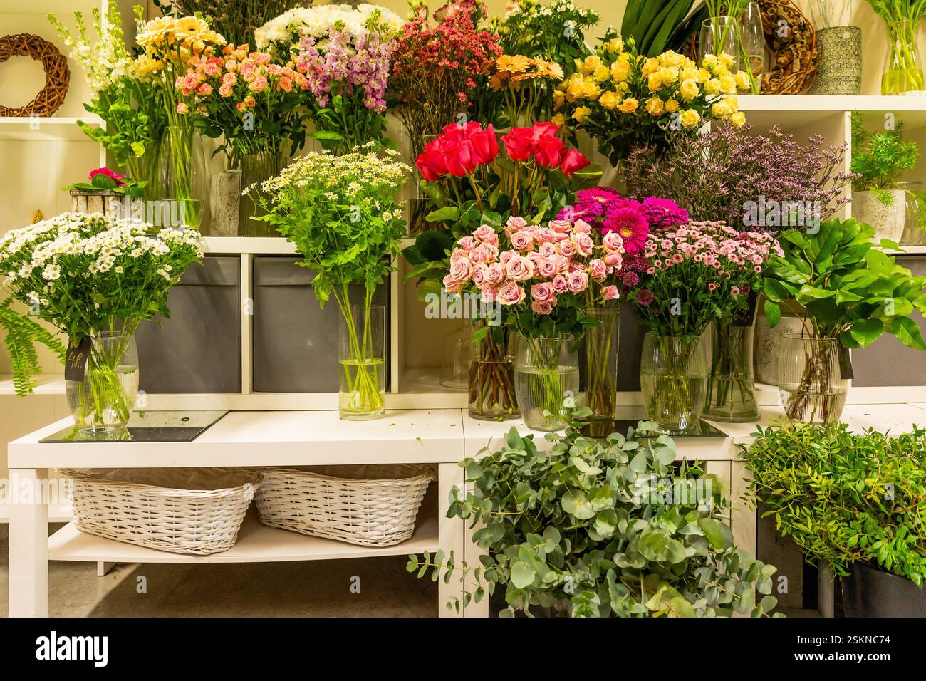 Flower shop displaying colorful bouquets and greenery for sale Stock ...