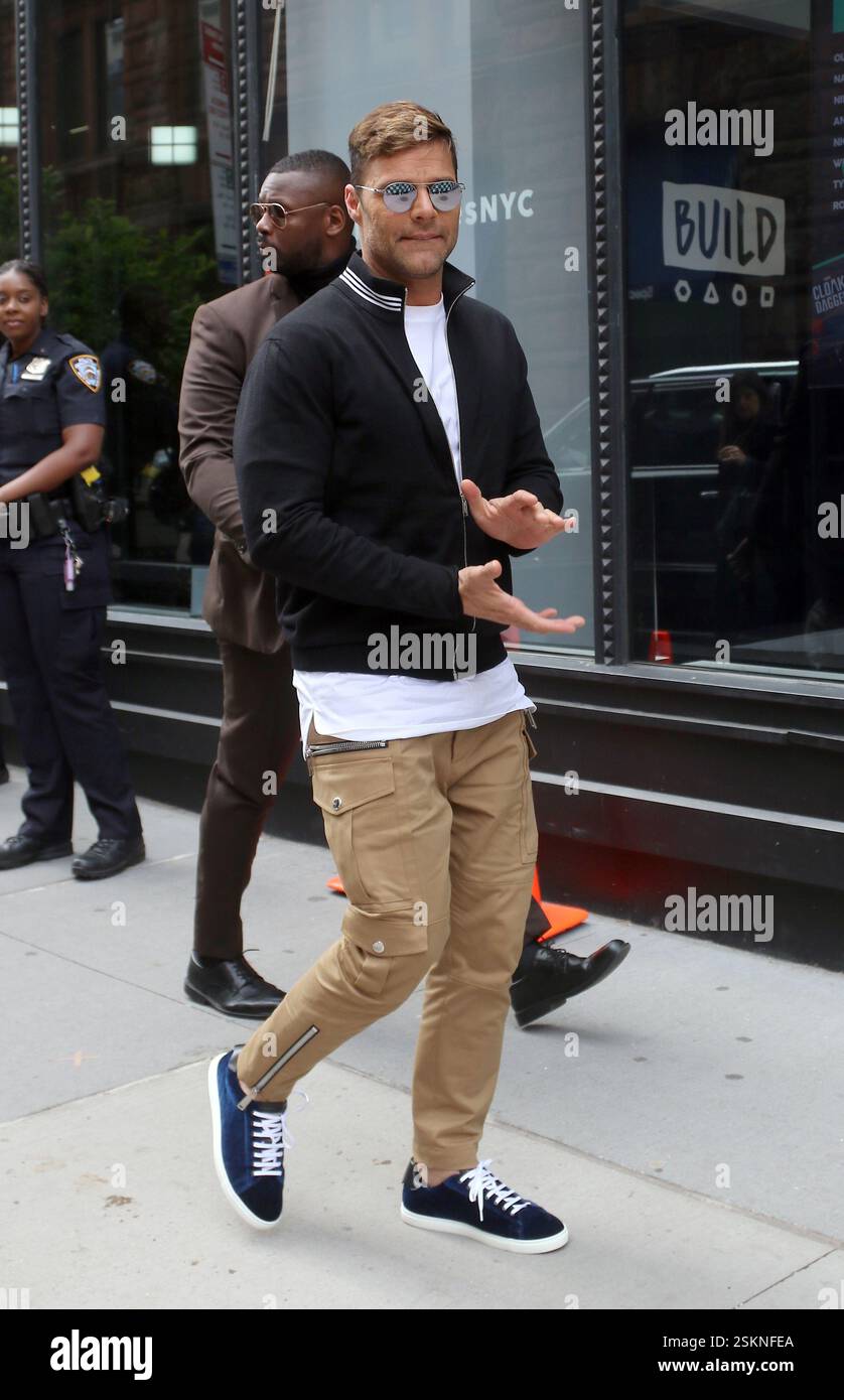 Singer Ricky Martin gets rushed by a fan as he leaves Build Series on ...