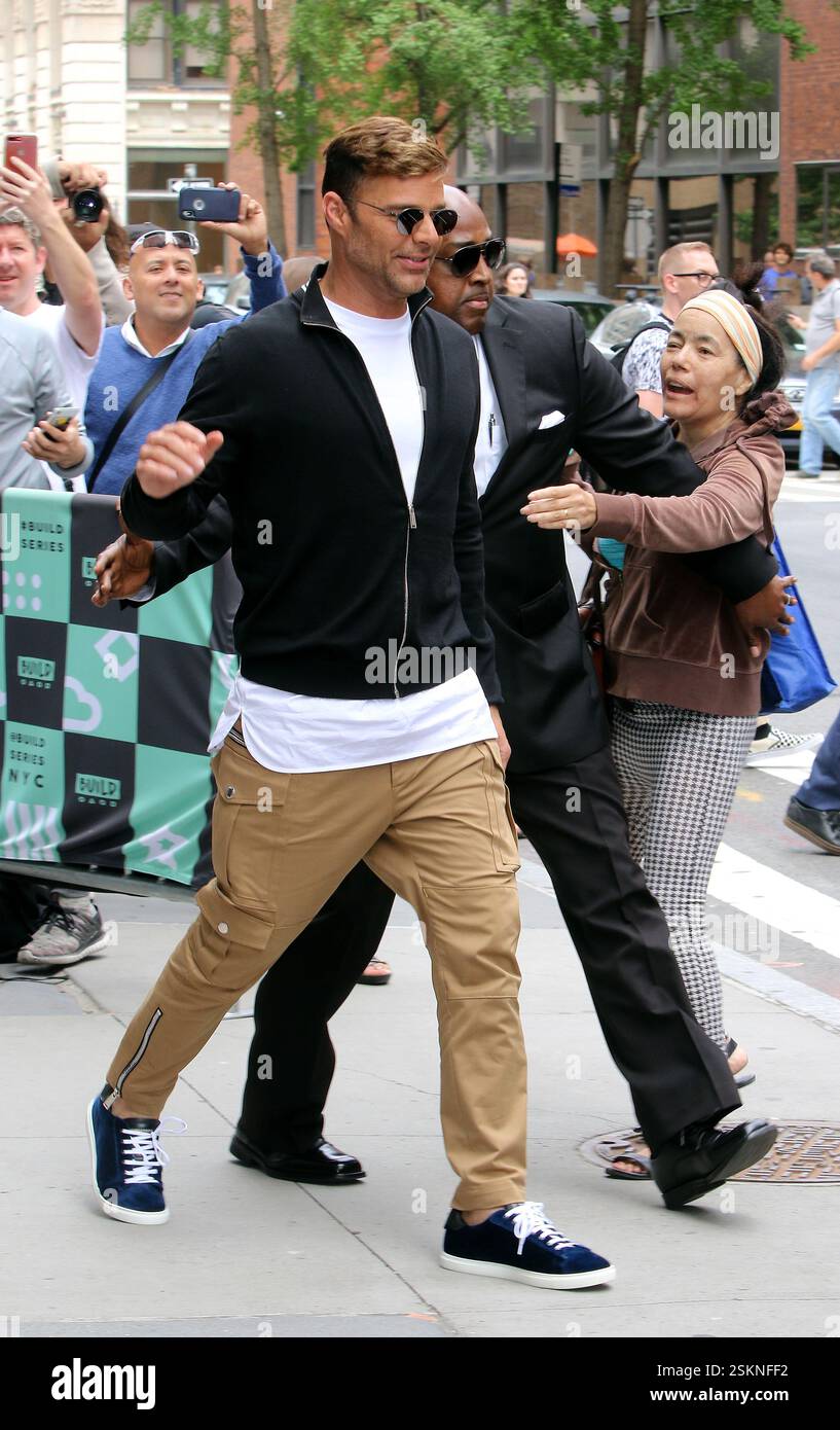 Singer Ricky Martin gets rushed by a fan as he leaves Build Series on ...