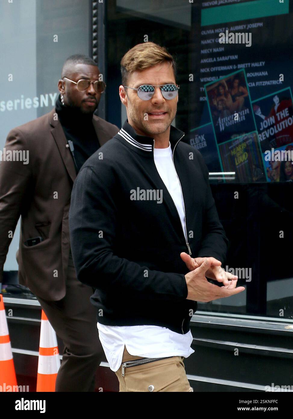 Singer Ricky Martin gets rushed by a fan as he leaves Build Series on ...