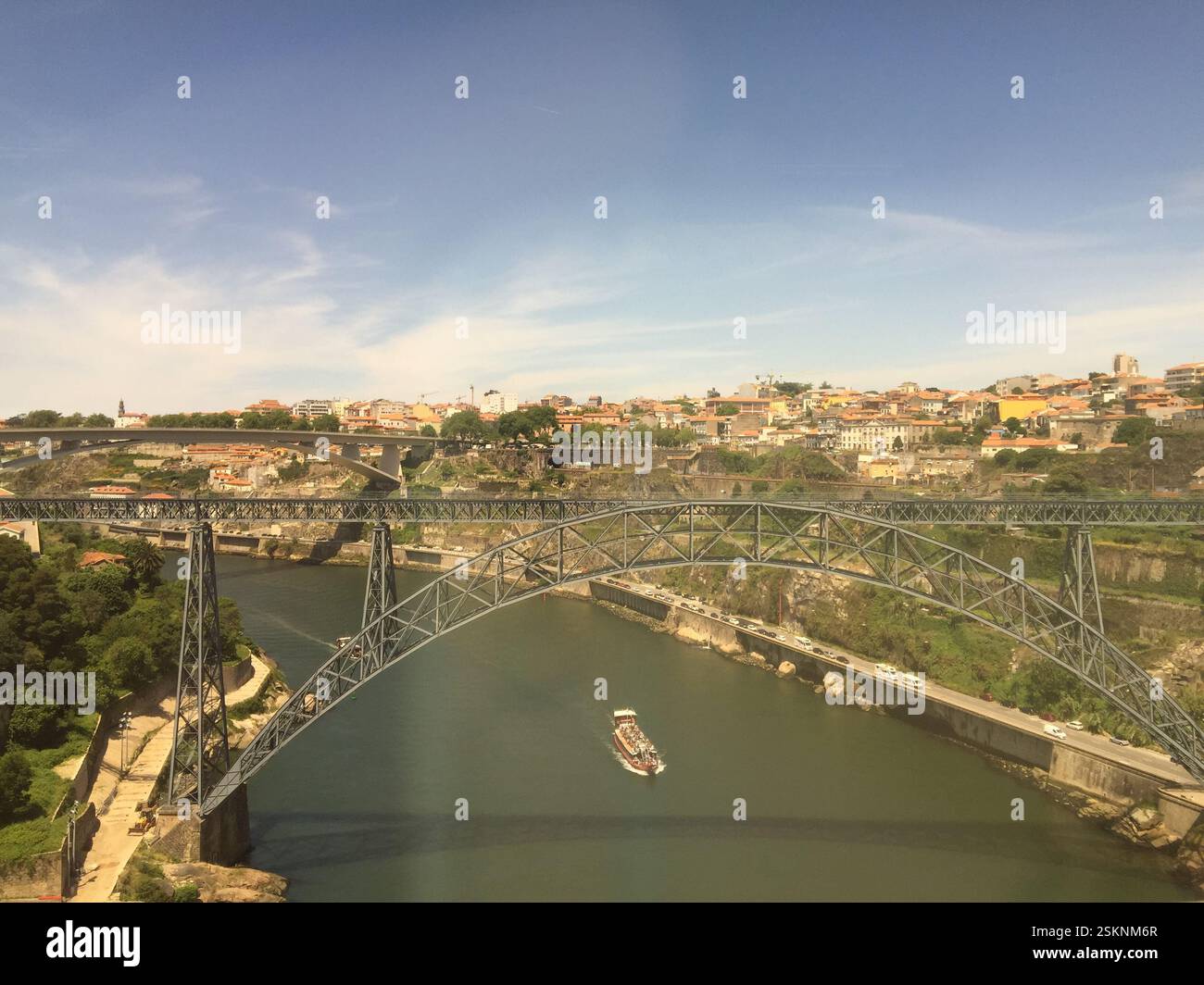 Arched metal bridge spanning Douro River, Braga, Portugal. Connects ...