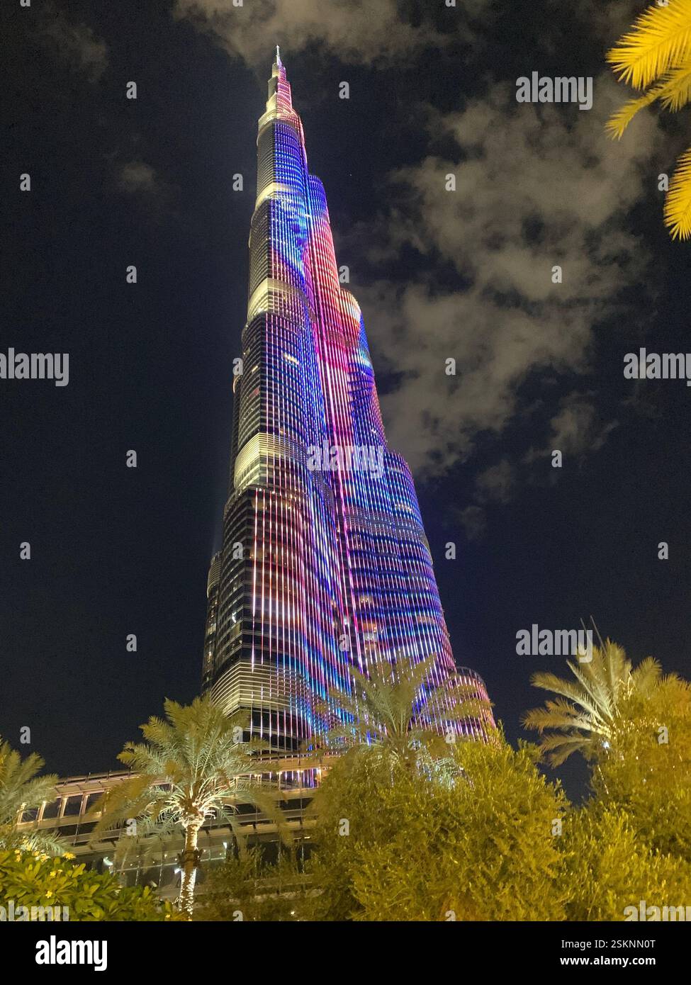 Burj Khalifa building lit up with colourful design at night Stock Photo ...