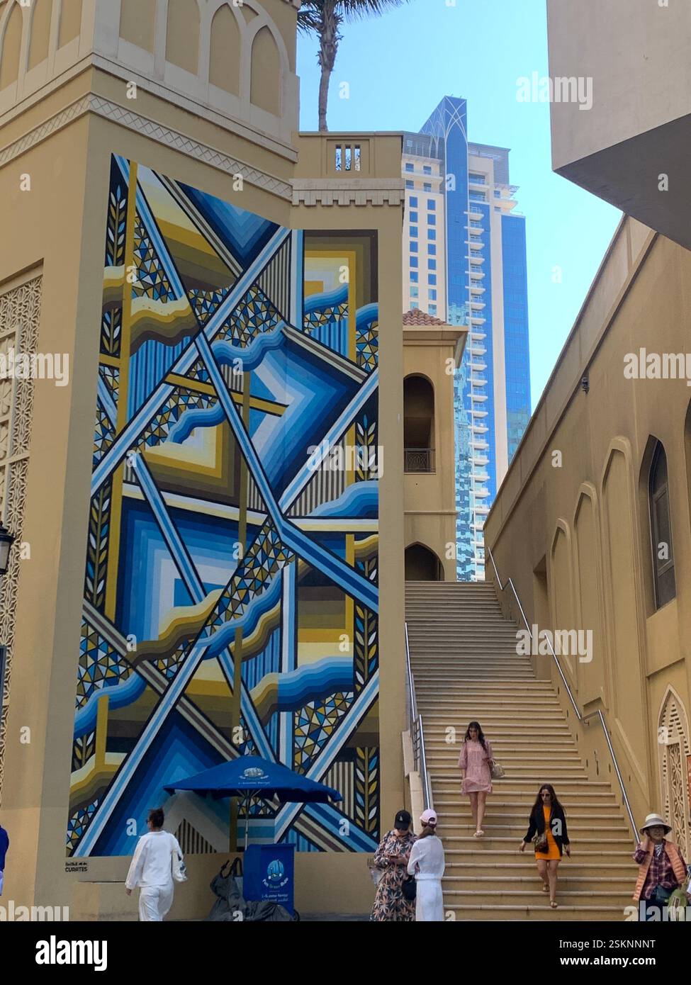 Large abstract blue mural on Dubai Marina building Stock Photo - Alamy