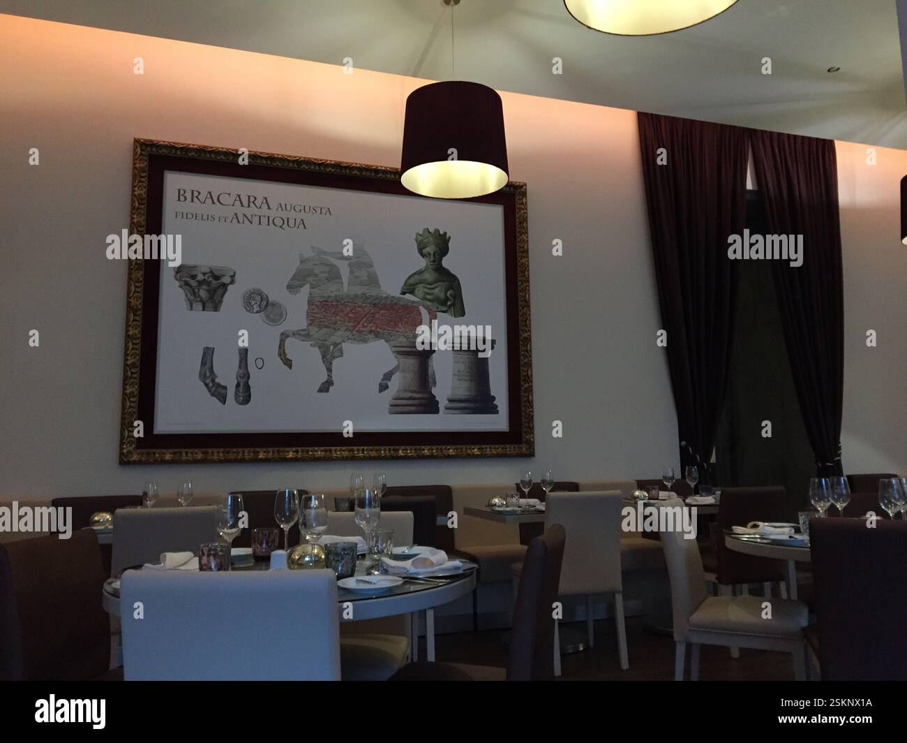 Interior of a restaurant, Braga, Portugal. Framed artwork displays ...