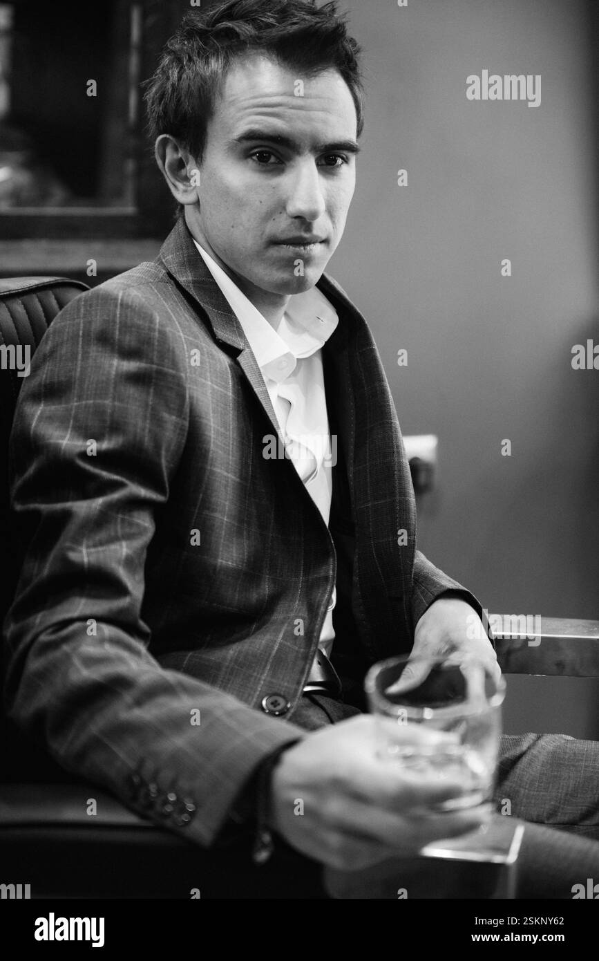 Young guy in grey checkered suit in barbershop on wedding day Stock ...