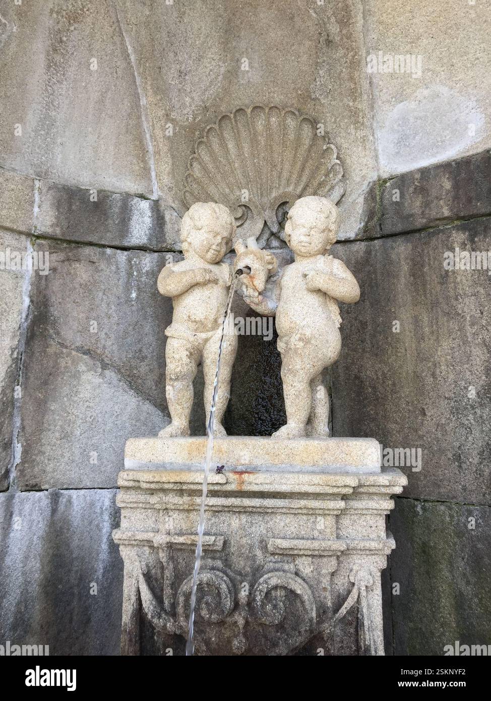Twin cherub statues adorn elaborate Baroque fountain in Braga, Portugal ...