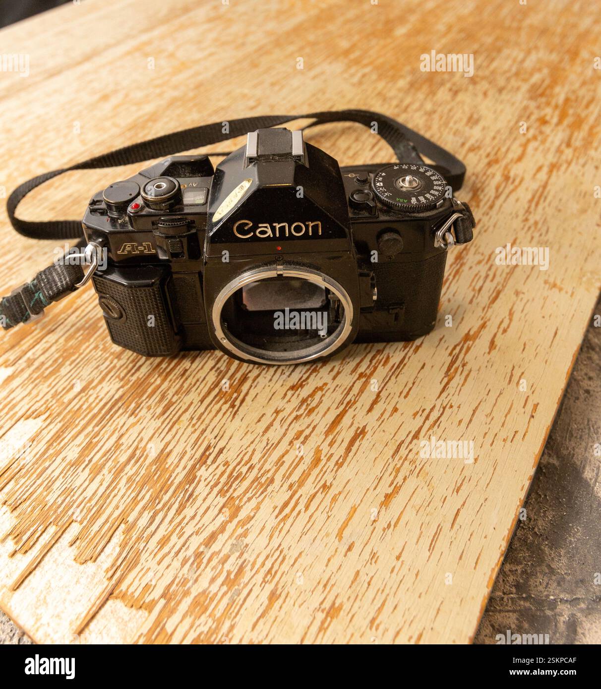 A well used soiled Canon A-1 35mm film single lens reflex camera with ...