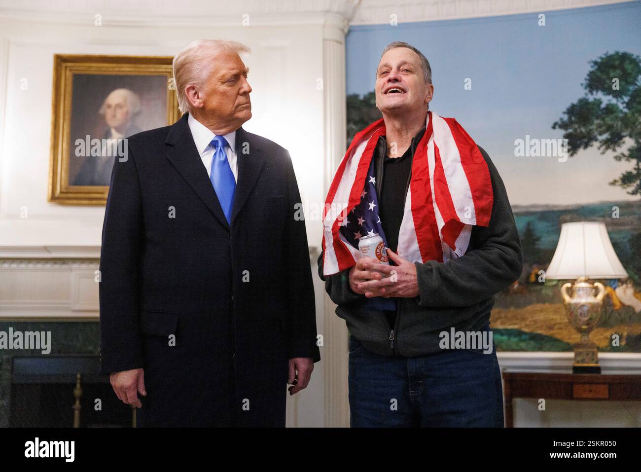US President Donald Trump greets Mark Fogel, who was recently released ...