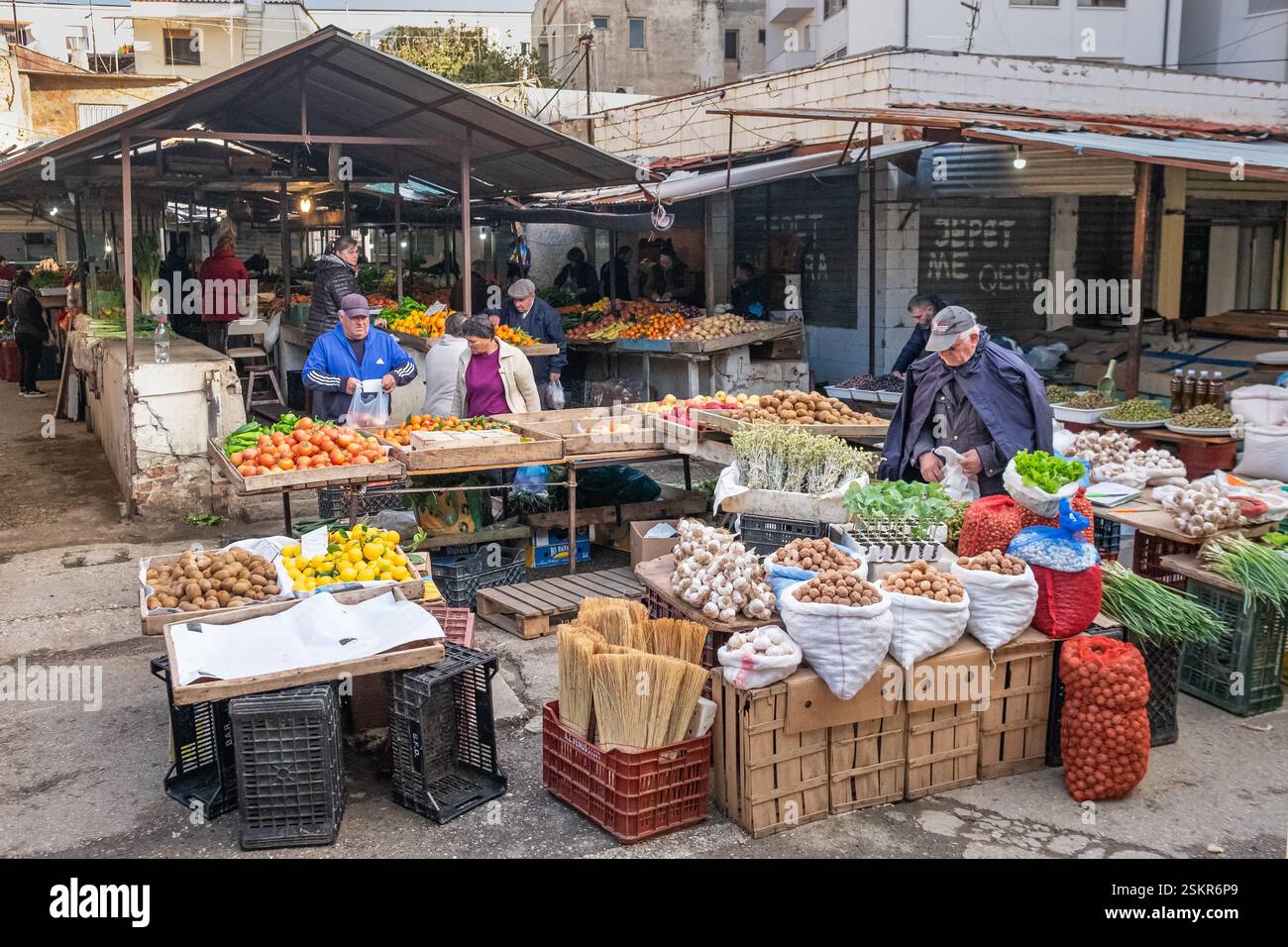 Farmers local market with seasonal vegetables on display with people ...