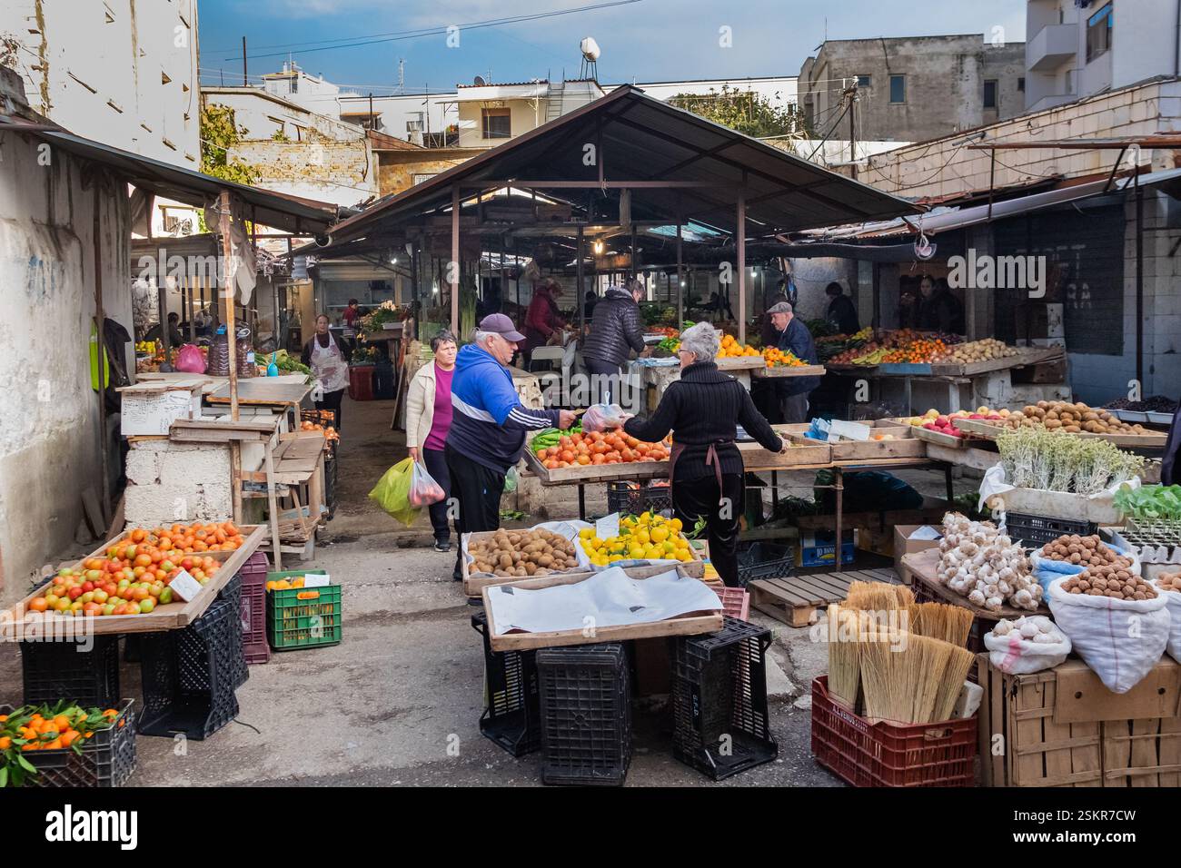 Farmers local market with seasonal vegetables on display with people ...