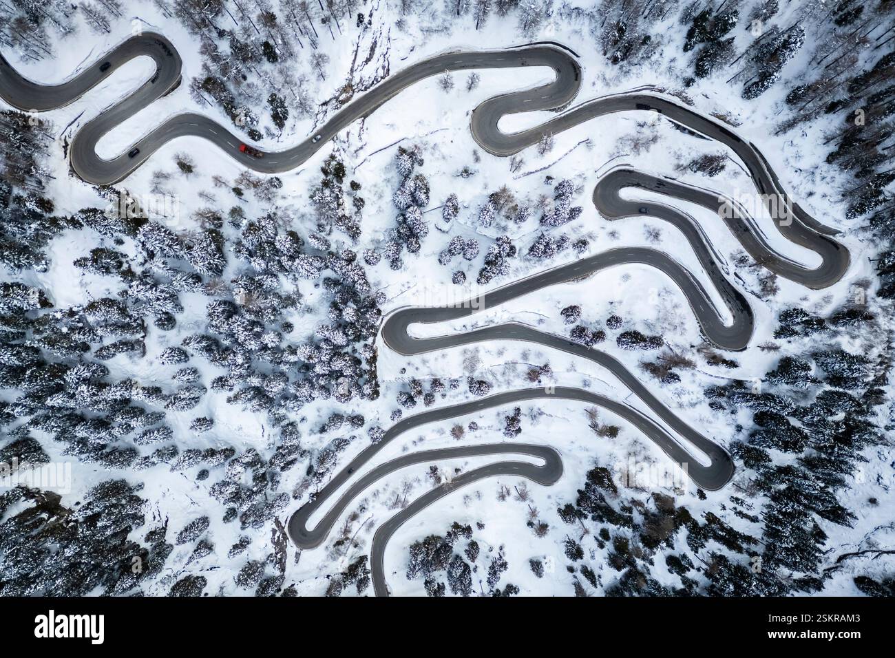 Aerial view of the Maloja Pass covered in snow. Maloja, Bregaglia ...