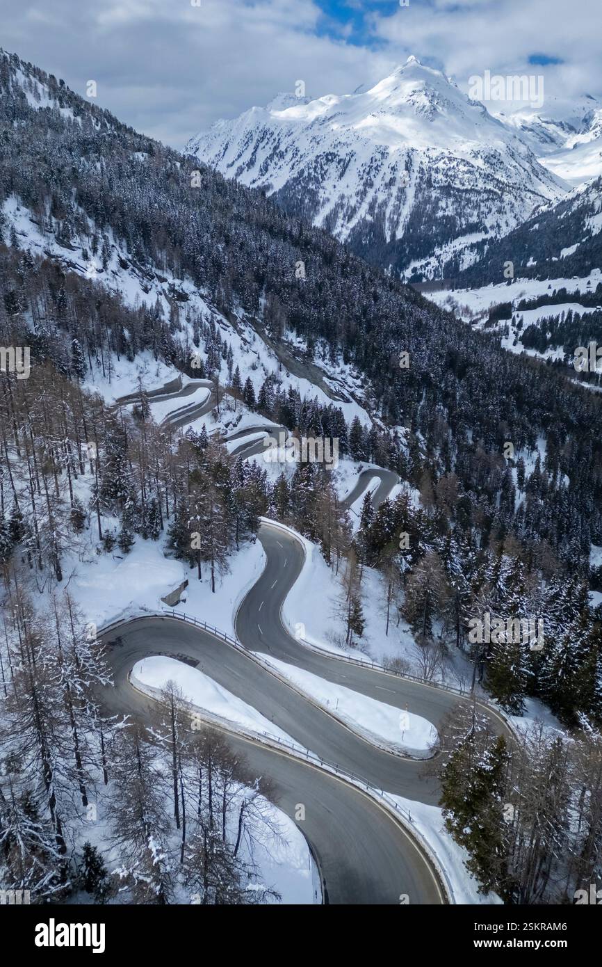 Aerial view of the Maloja Pass covered in snow. Maloja, Bregaglia ...