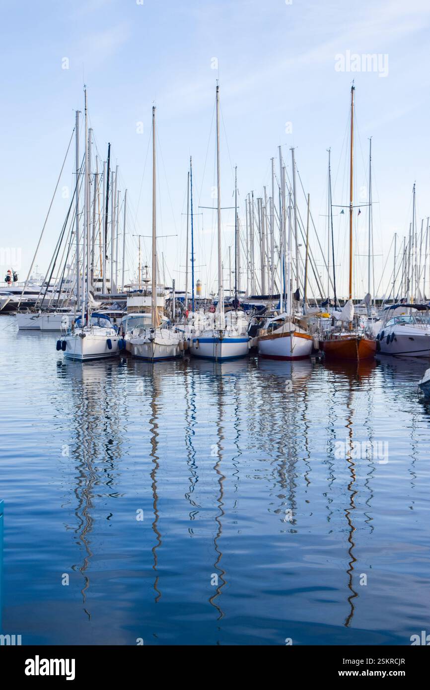 Sailboats reflected in the Old Port of Cannes, France, 2019. Credit ...