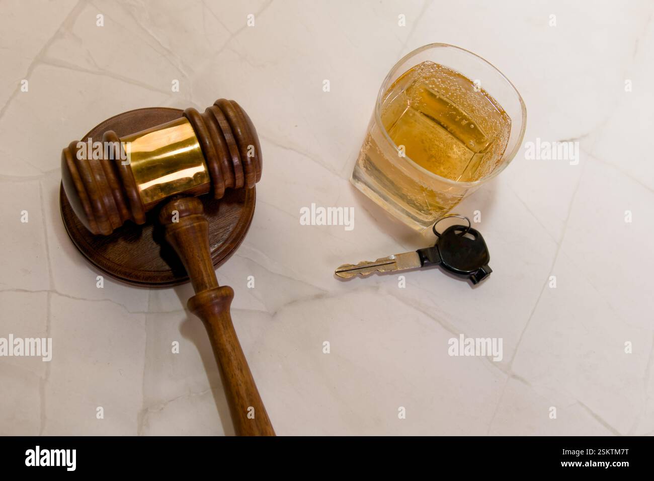 A gavel, whiskey, and car keys symbolize the link between law and ...