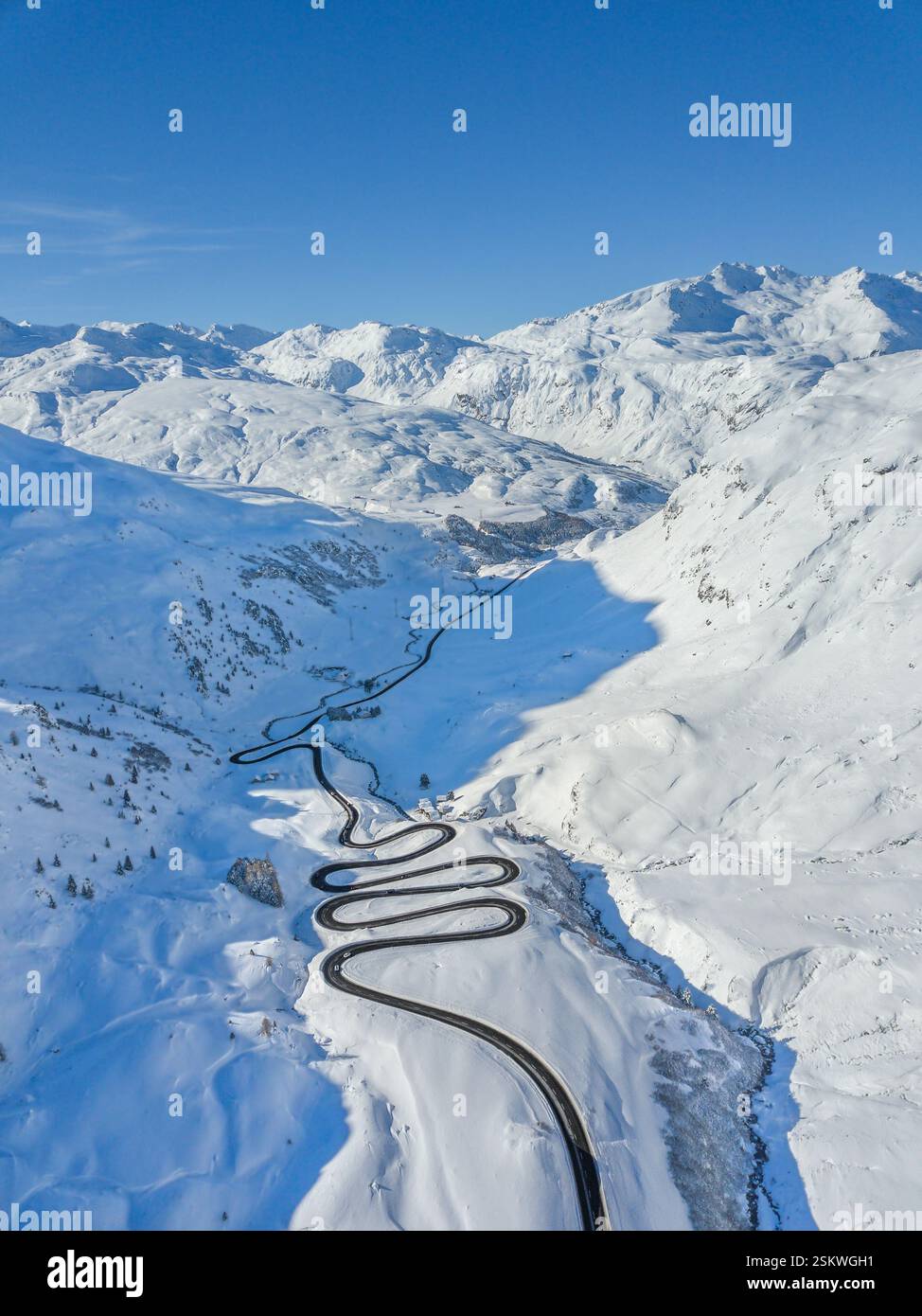 Aerial view of the winding road over the Julier Pass in Swiss Alps ...