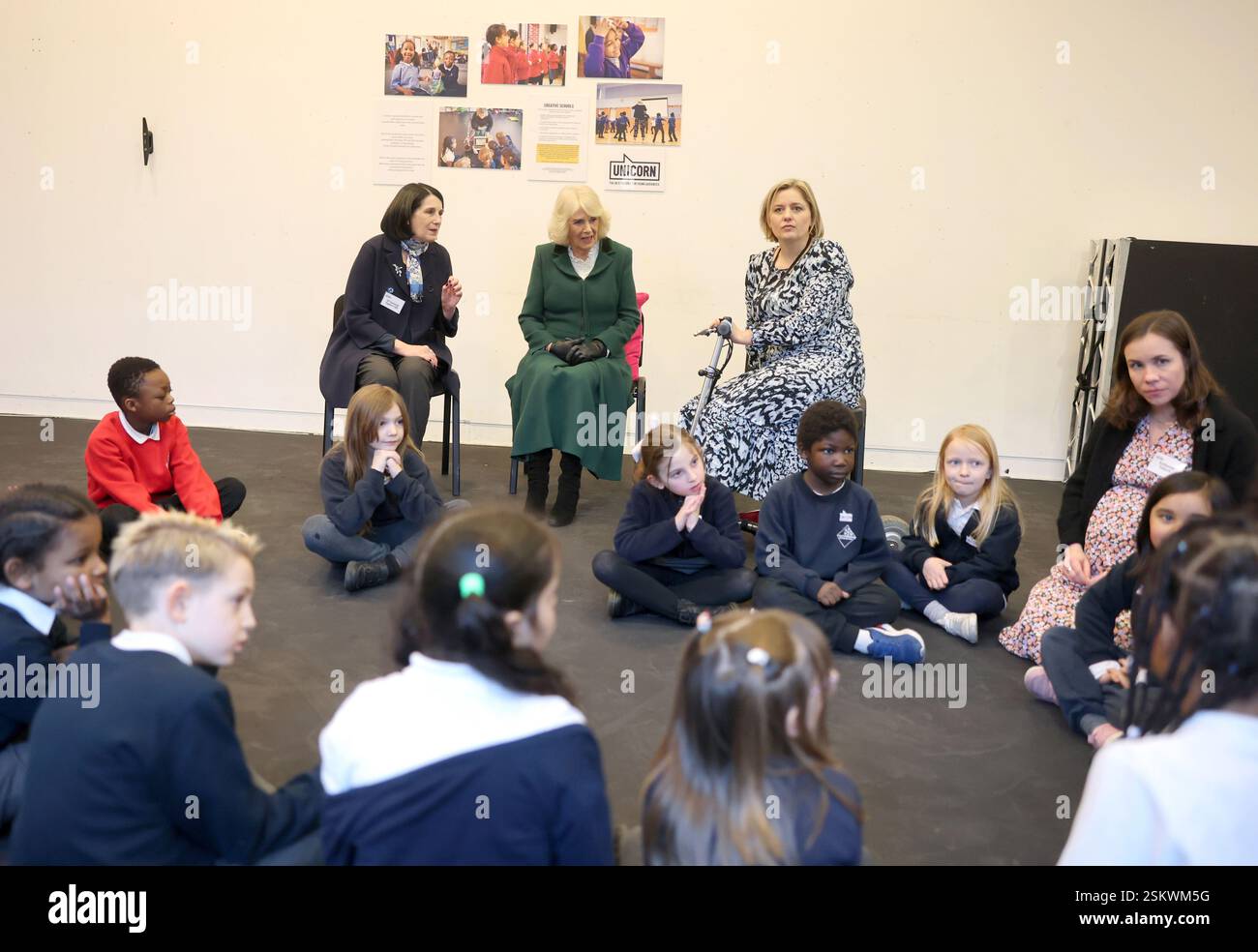 Queen Camilla watches as children from Snowfields Primary School ...