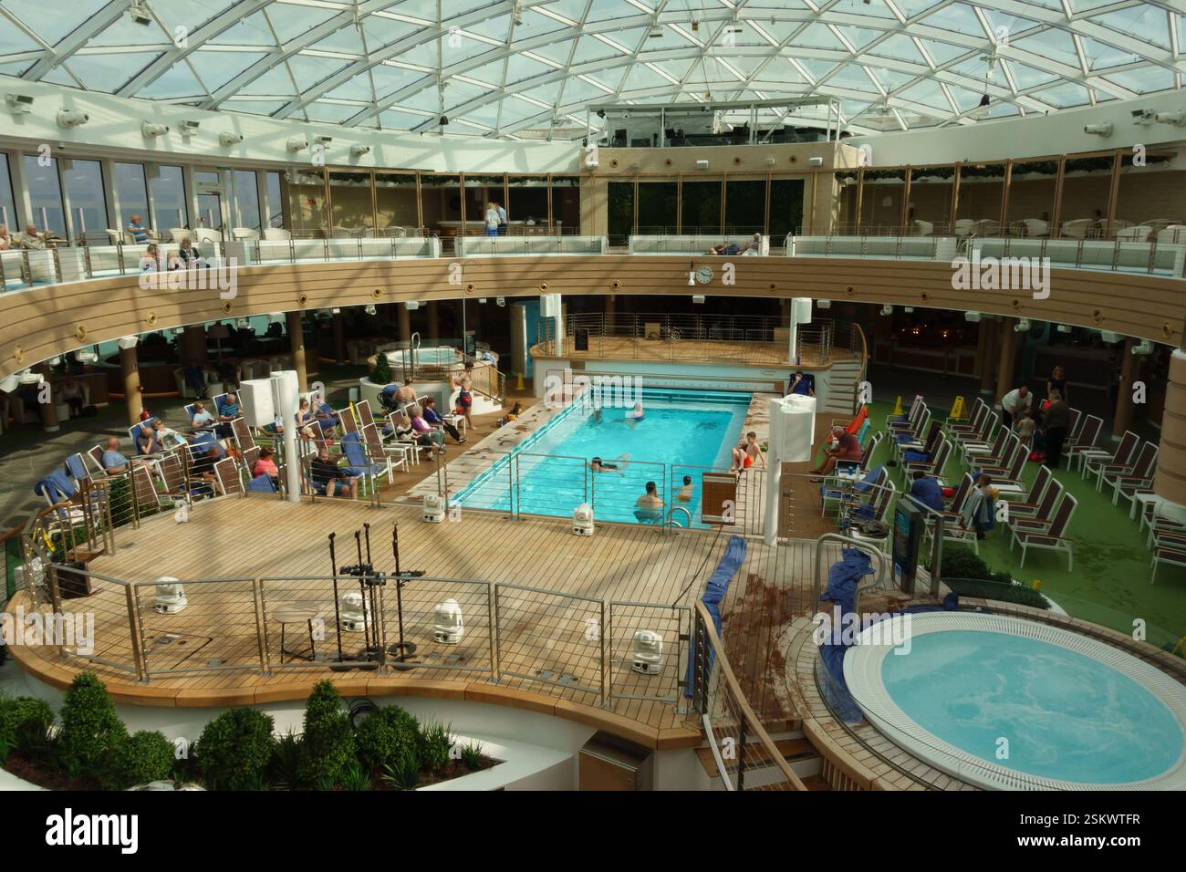 Cruise ship passengers relaxing in Skydome swimming pool area on P&O MS ...
