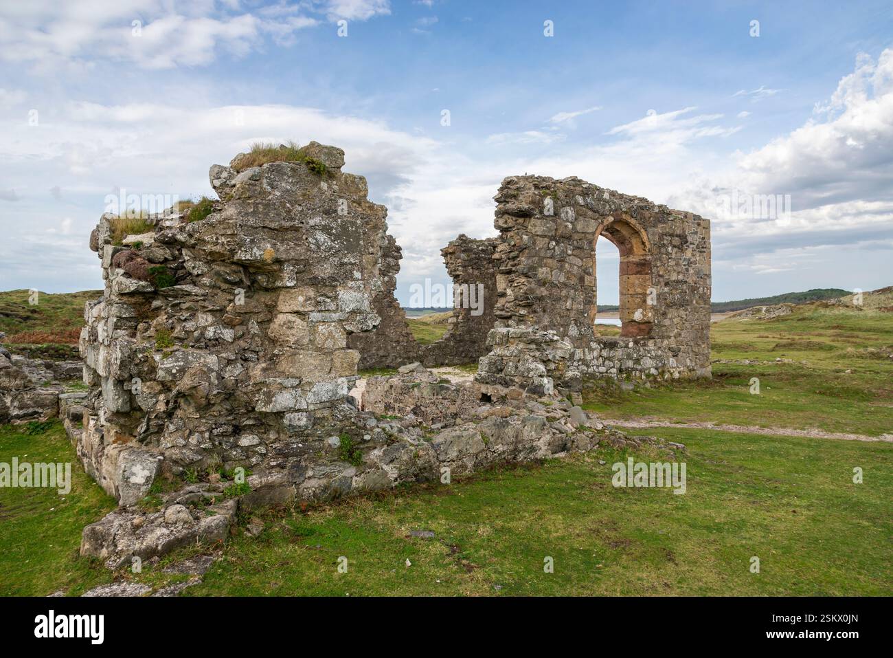 The ruins of St Dwynwen's church on Llanddwyn Island on Anglesey, North ...