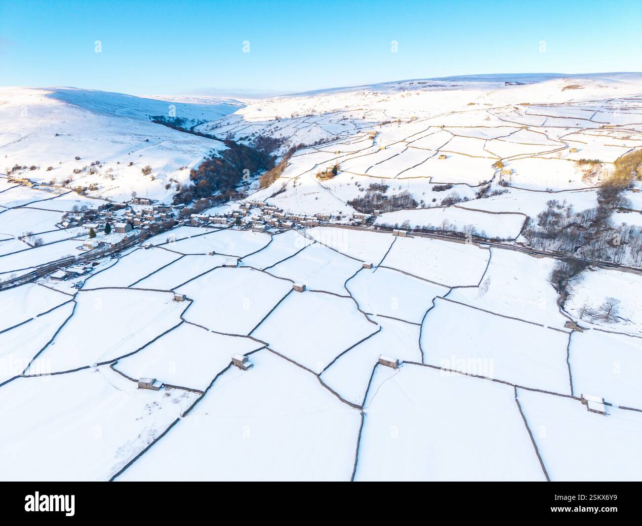 Meadows at Gunnerside in Swaledale covered with snow, showing the ...