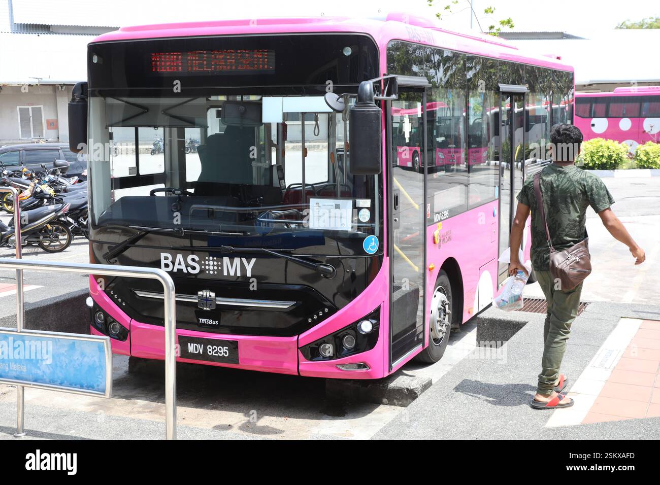 Pink local bus at Melaka Sentral public transport terminal, Melaka ...