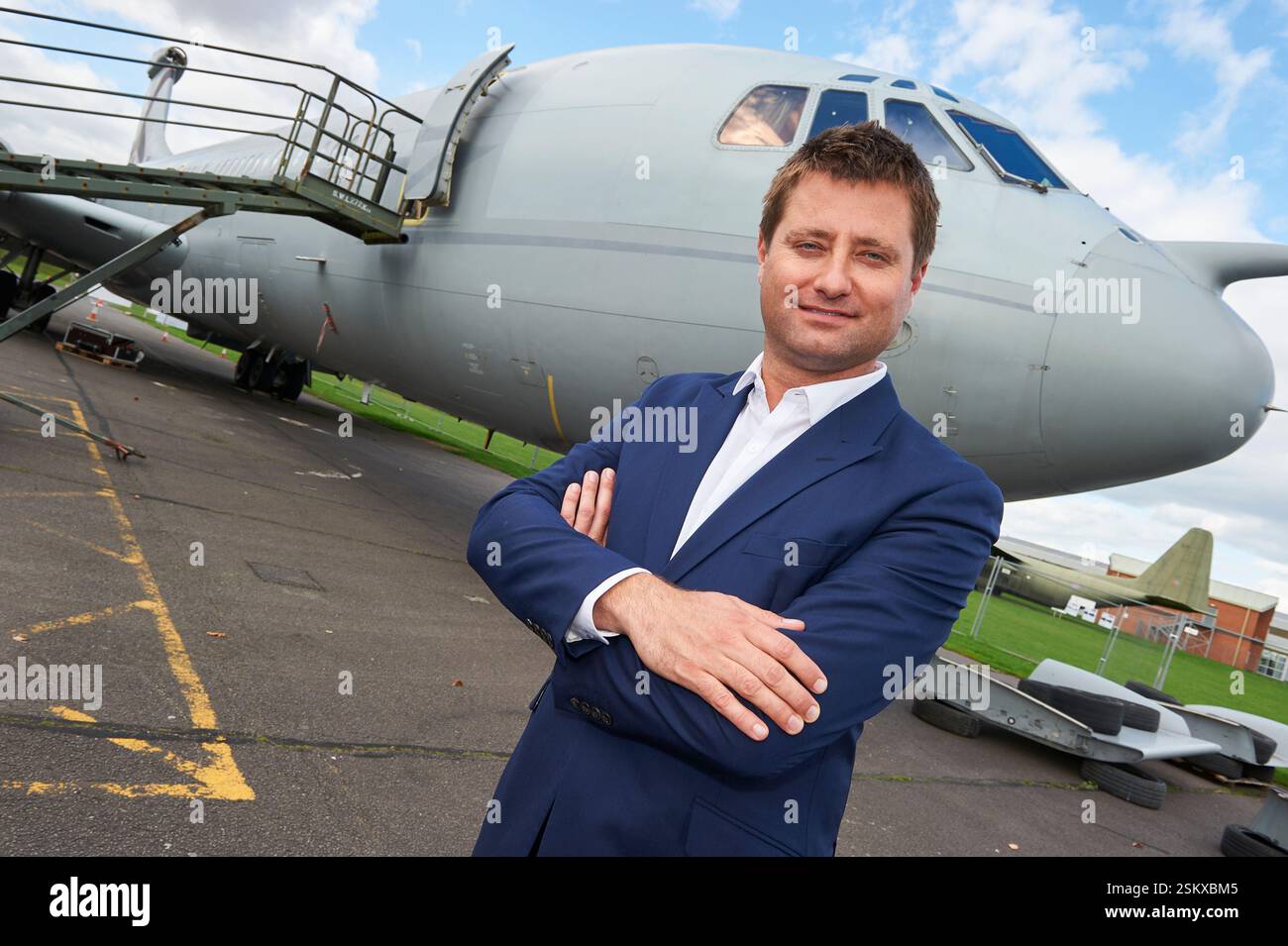 George clarke in a suit arms folded hi-res stock photography and images ...