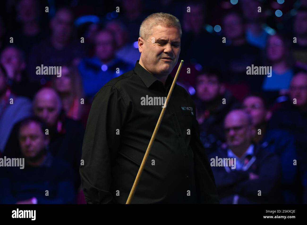 Robert Milkins reacts during his Round 2 match against John Higgins ...