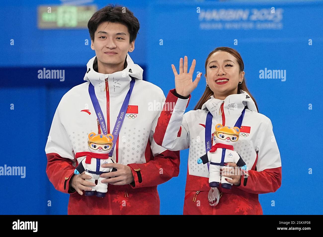 Silver medalists China's Ren Junfei, left, and Xing Jianing pose during ...