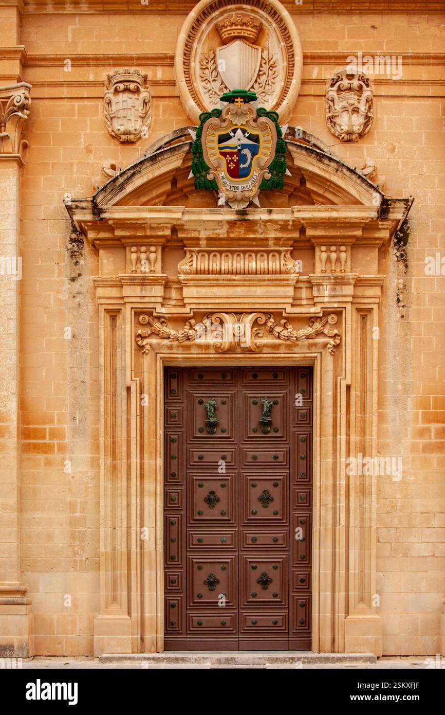 Entrance door to St. Paul's Cathedral (Katidral ta’ San Pawl) with Coat ...