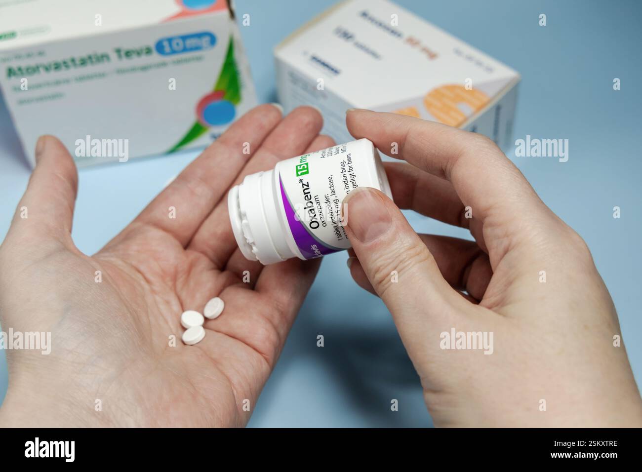 Female hands holding Oxabenz sedative pills. Prescription medication ...